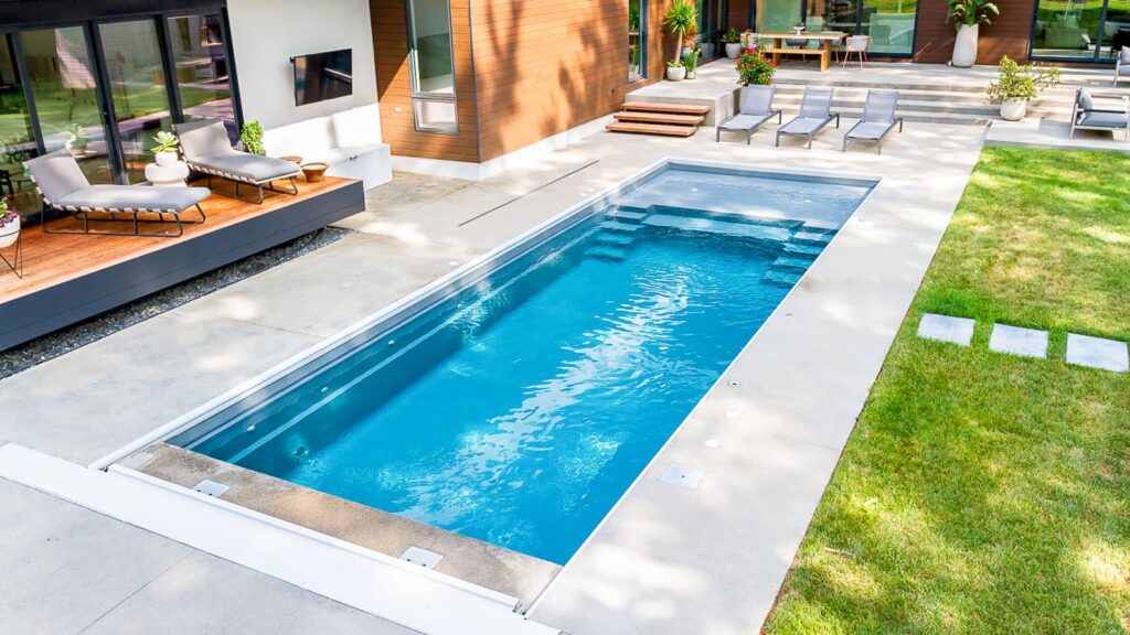 The Freedom with Splash Pad Fiberglass Pool | Regional Pool Group